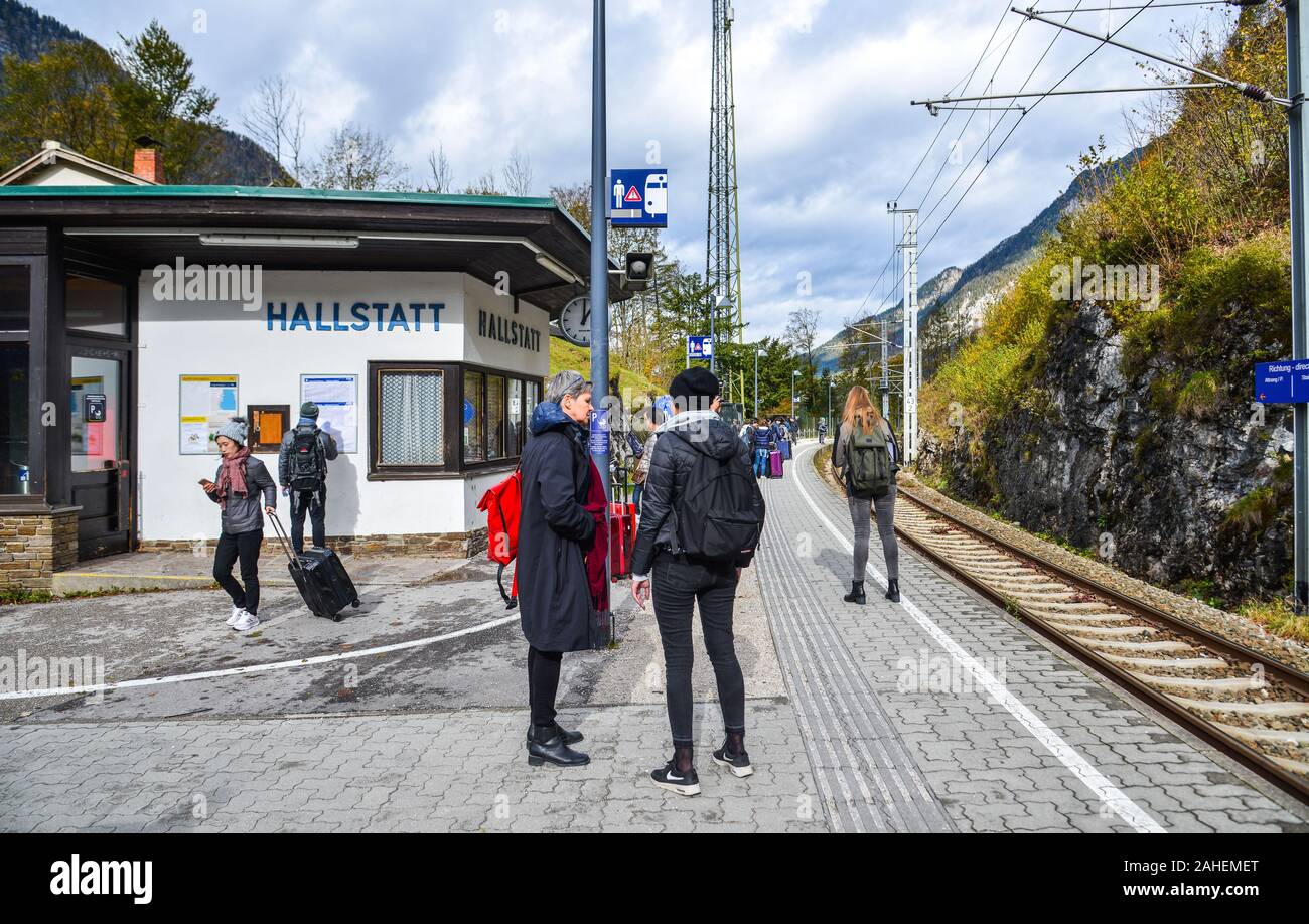 Hallstatt, Austria - Oct 25, 2018. Passengers waiting at train station ...