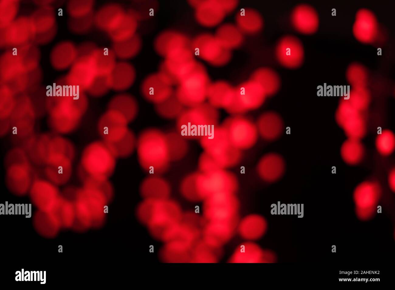 wallpaper patterned with round shaped red lights on black background ...