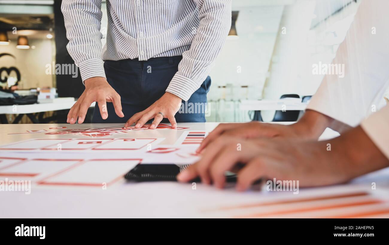 App developer Ux Ui designing with paper model on mobile application ...