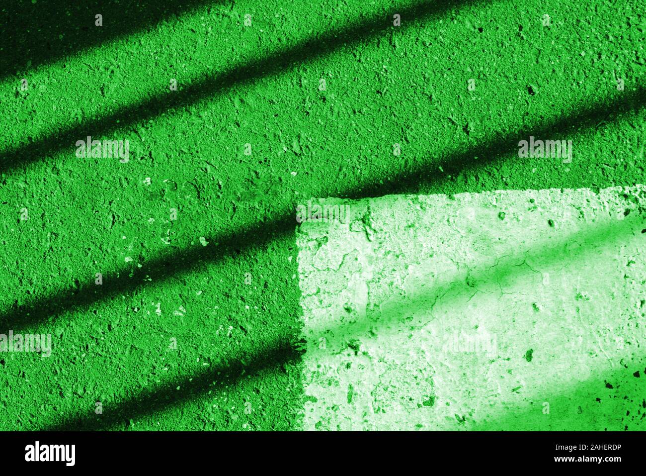 Asphalt surface with white paint and shadow. Abstract background green ...