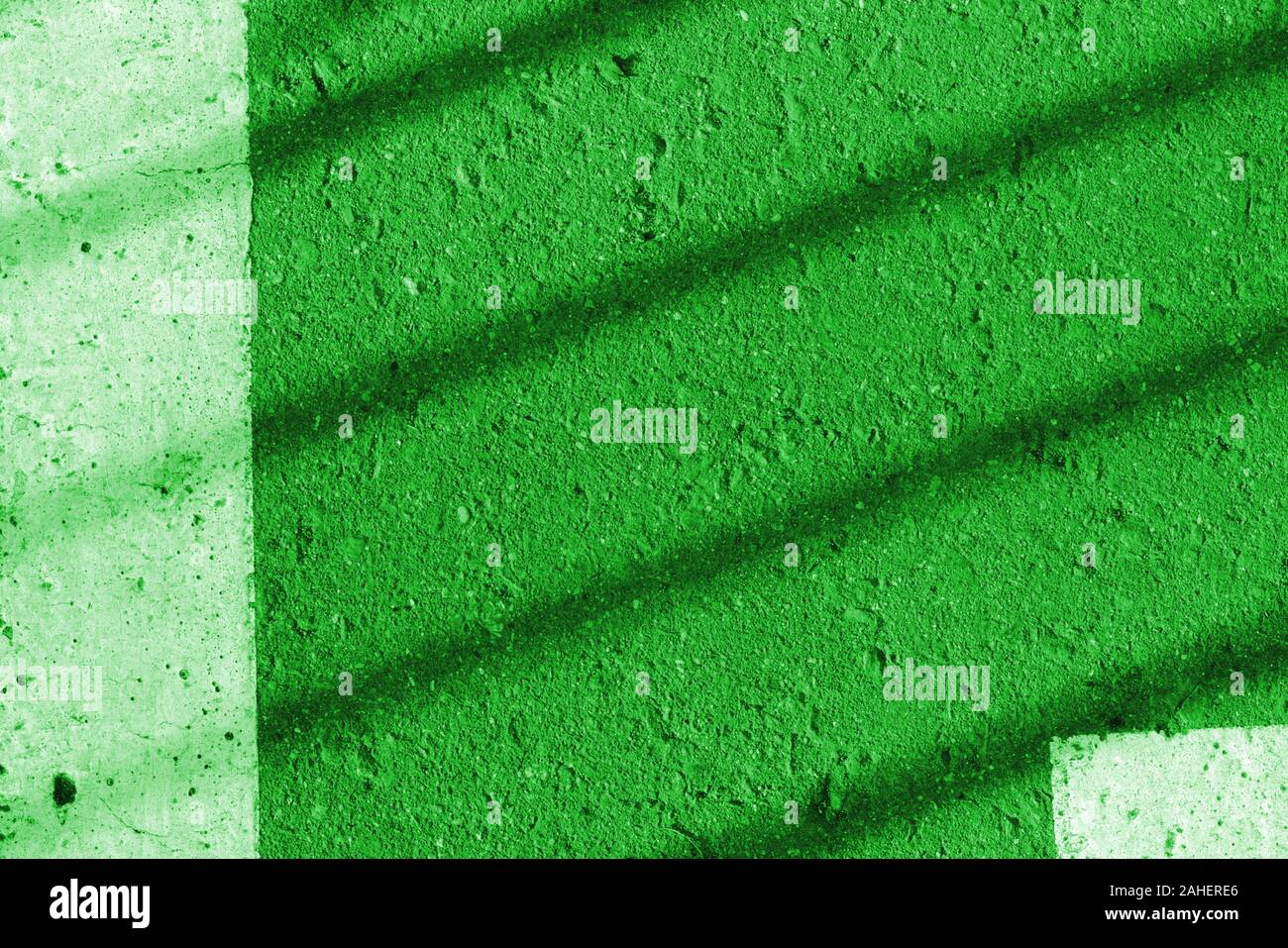 Asphalt surface with white paint and shadow. Abstract background green ...