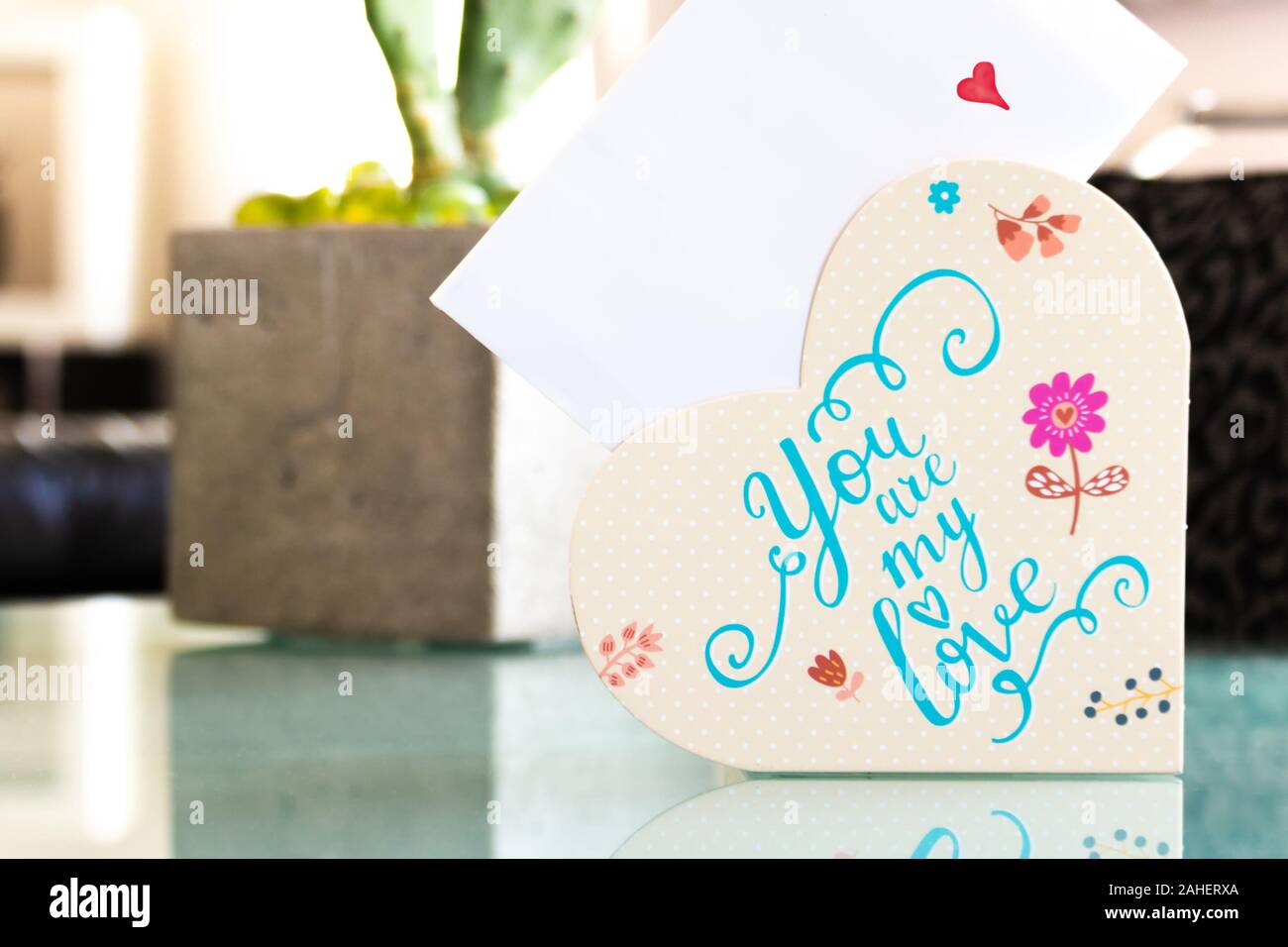 love message inserted on the cardboard heart Stock Photo - Alamy