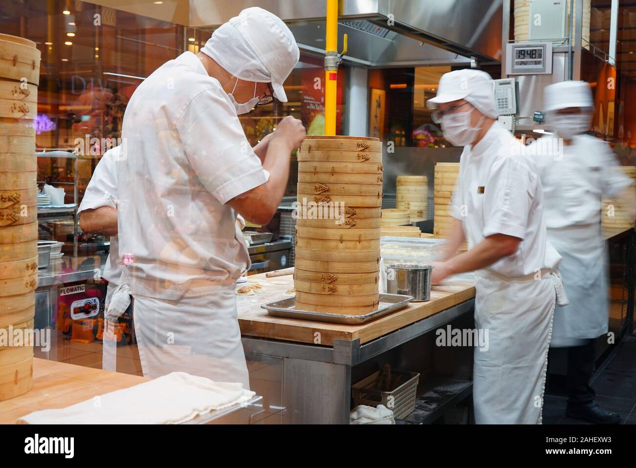 SINGAPORE -9 DEC 2019- View of cooks preparing steamed xialongbao ...