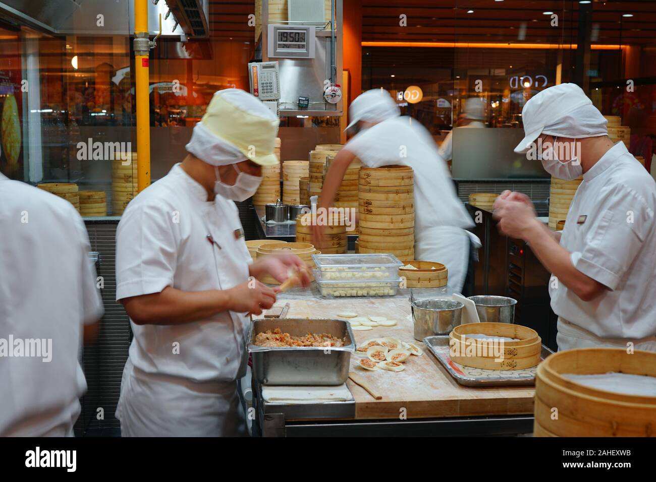 SINGAPORE -9 DEC 2019- View of cooks preparing steamed xialongbao ...
