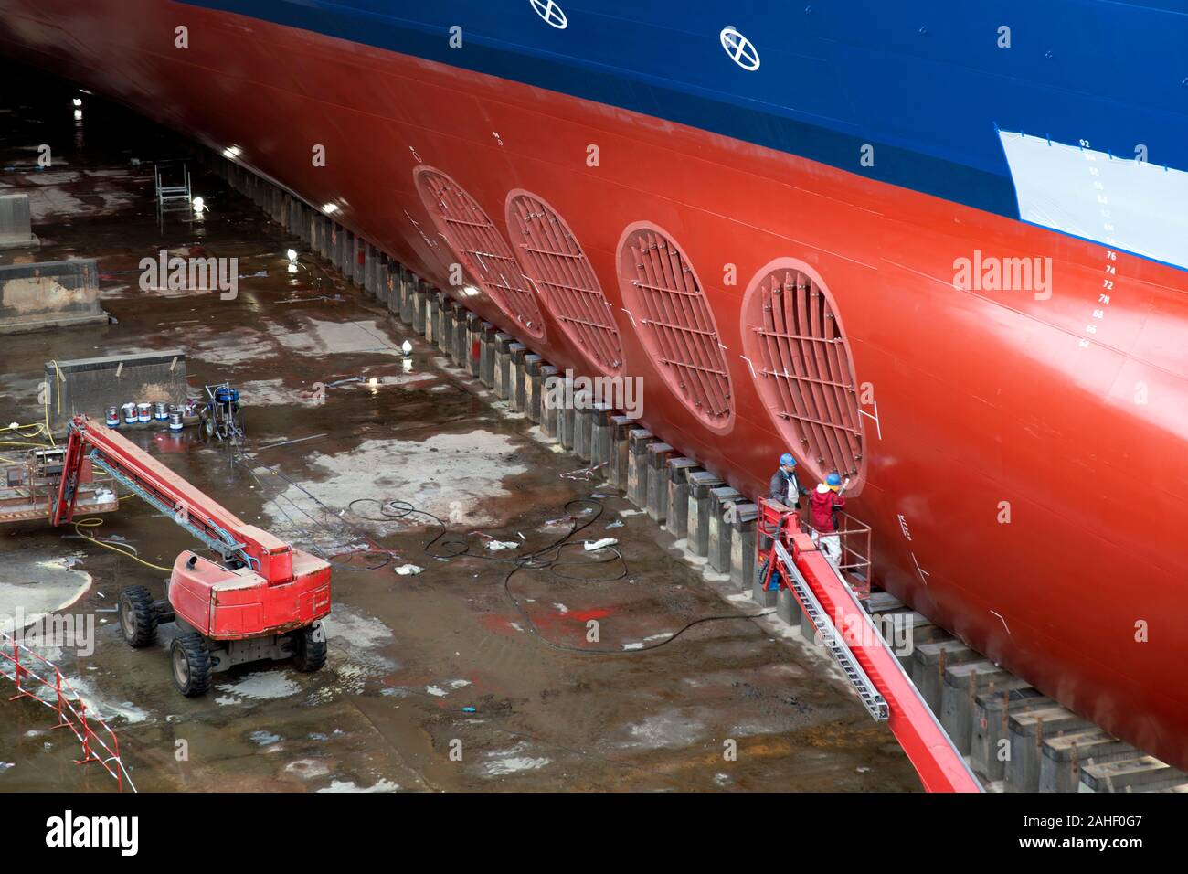 Ship in dry dock in a port for repairs Stock Photo - Alamy
