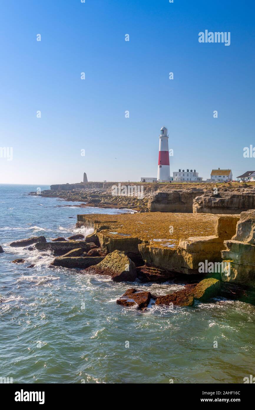 The lighthouse and the Portland stone ledges at the southernmost tip of ...