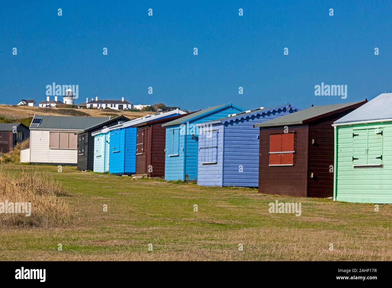 Colourful wooden sheds used as 'beach huts' and the former high ...