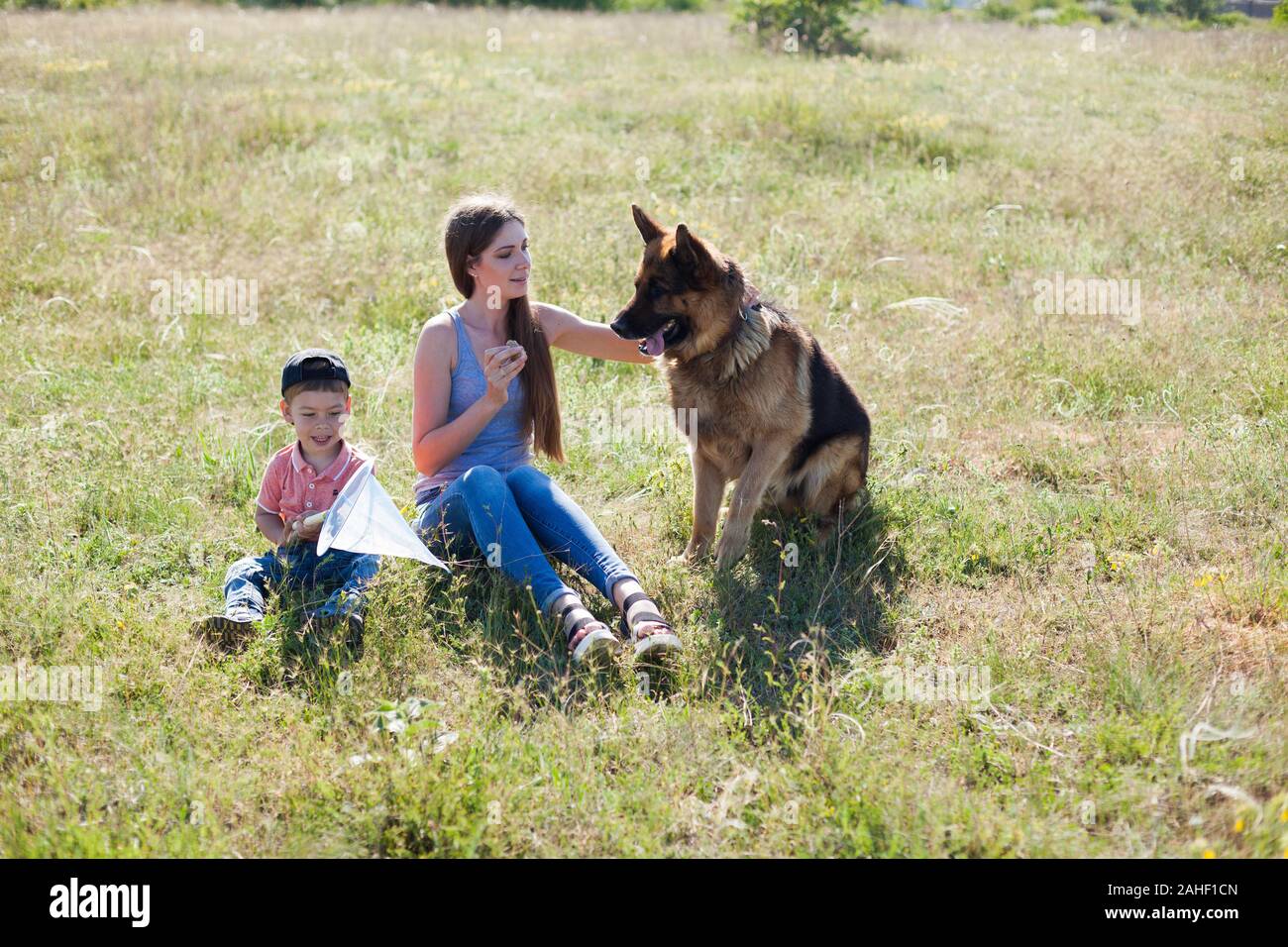 Mom with dog German Shepherd on a walk Stock Photo - Alamy