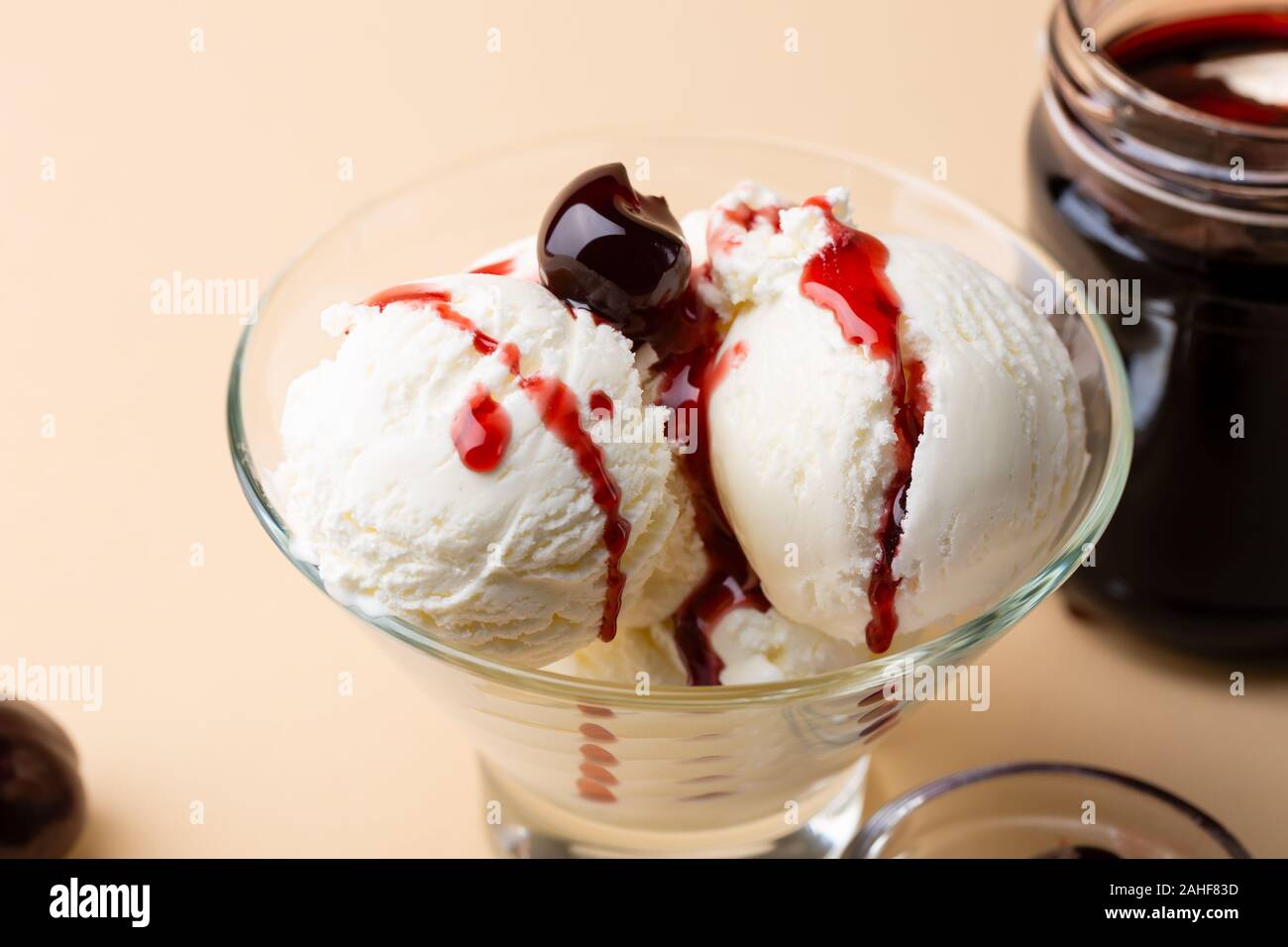 Ice cream and cherry topping Stock Photo - Alamy