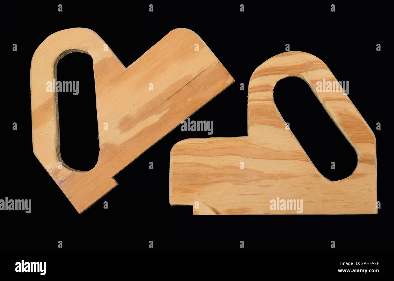 Plywood push sticks isolated on a black surface Stock Photo - Alamy