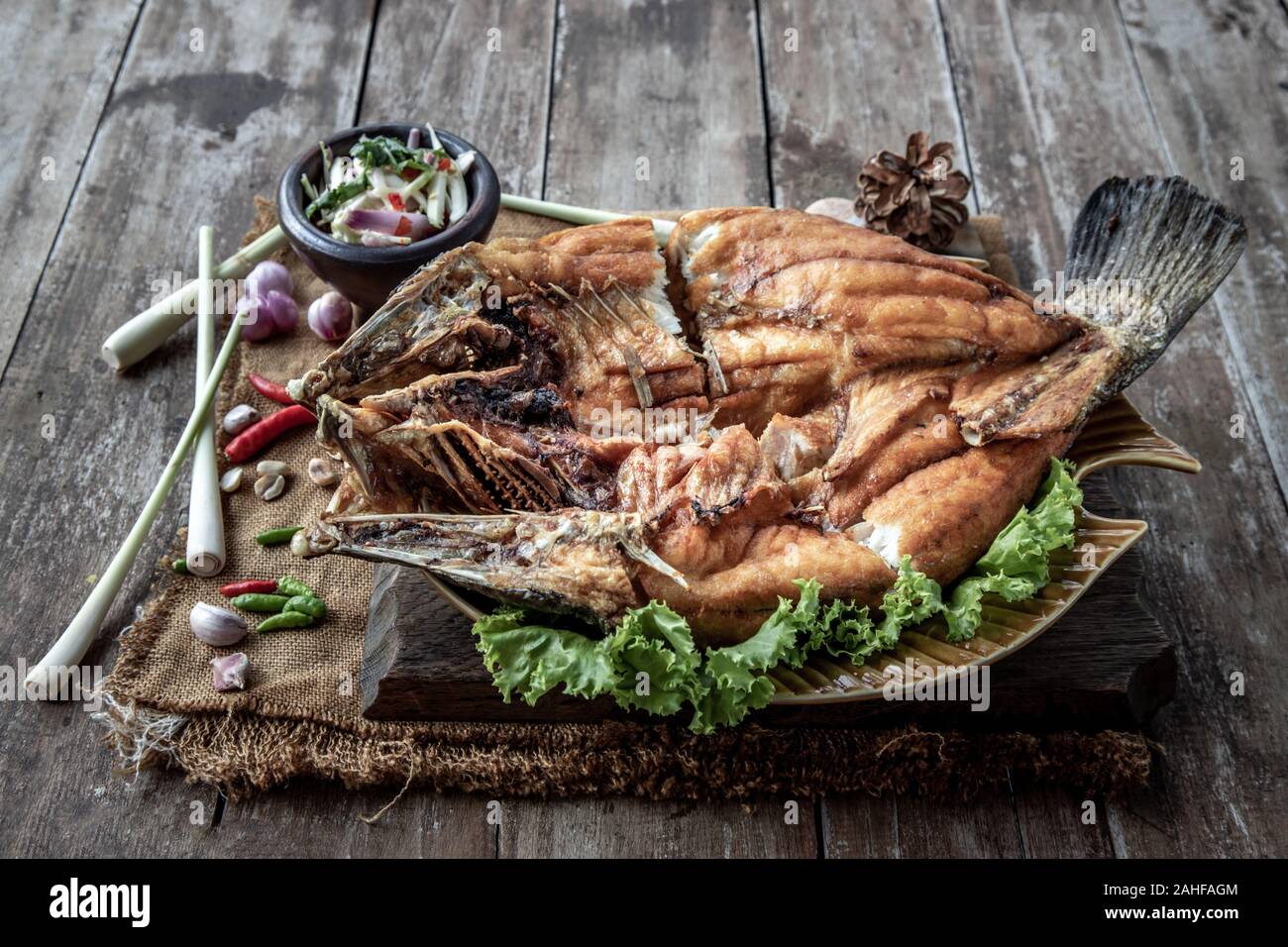 Deep fried Snapper with fish sauce on vintage wooden, The perfect ...