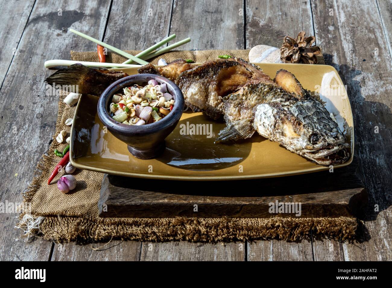 Deep fried whole Snakehead with spicy lemongrass salad, Thai food for ...
