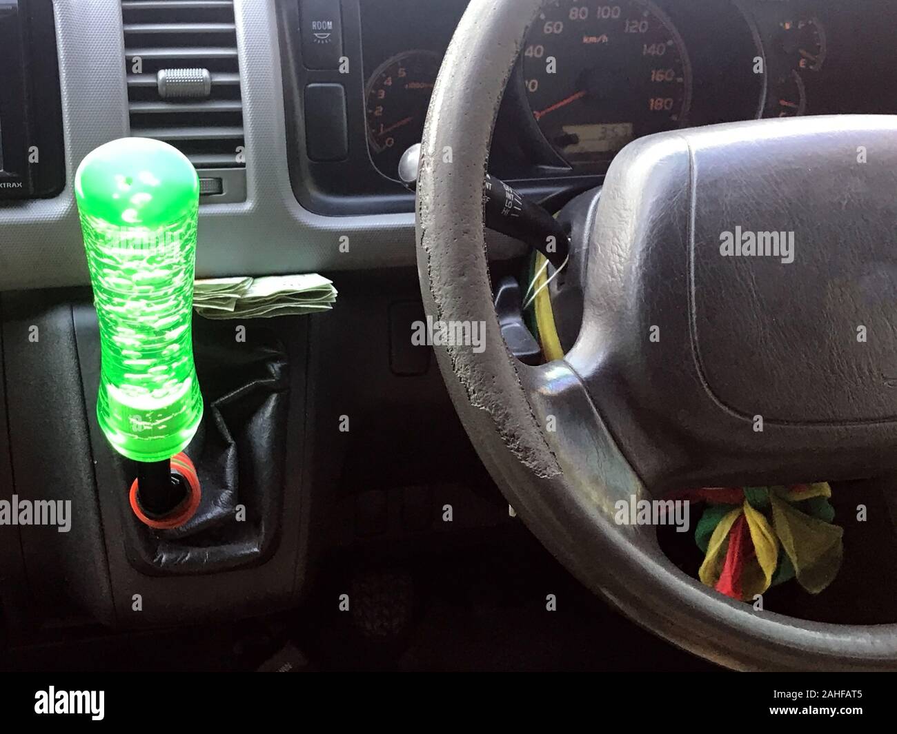 Steering wheel with decorative gear shift in a minivan, close up Stock ...