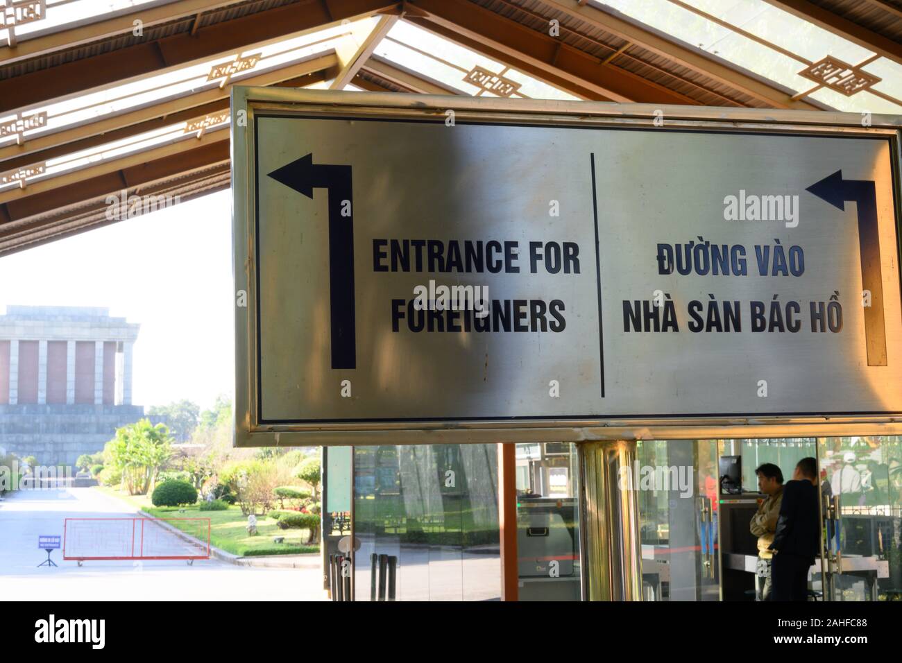 Separate entrance for foreigners sign with a pointing arrow Stock Photo ...