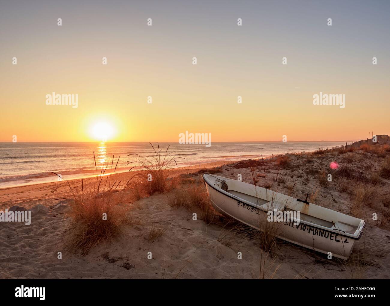 Faro Beach at sunset, Ilha de Faro, Ria Formosa Natural Park, Faro ...