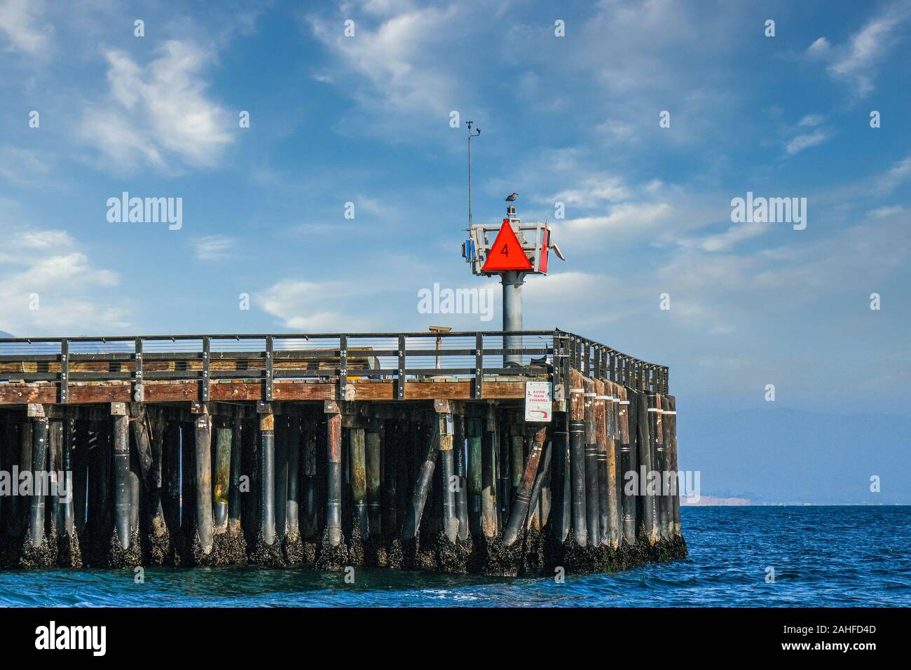 Navigation Marker on End of Pier Stock Photo - Alamy