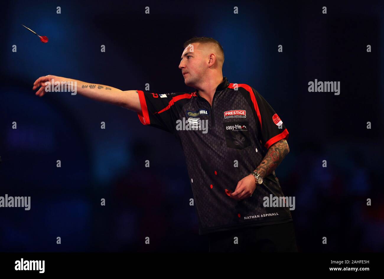 Nathan Aspinall in action during day fourteen of the William Hill World ...