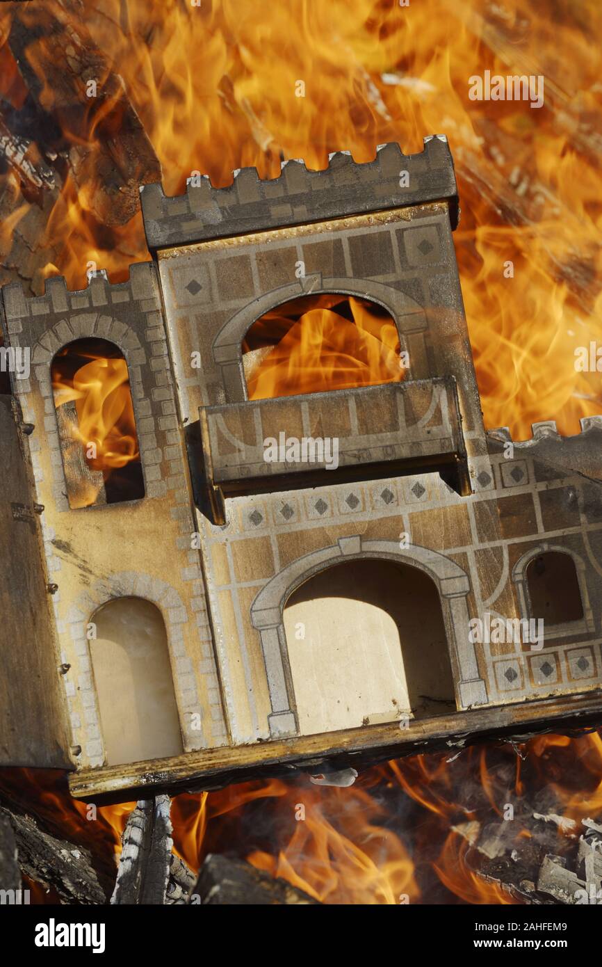 Wooden toy castle burning in flames on a bonfire, Wales, UK Stock Photo ...