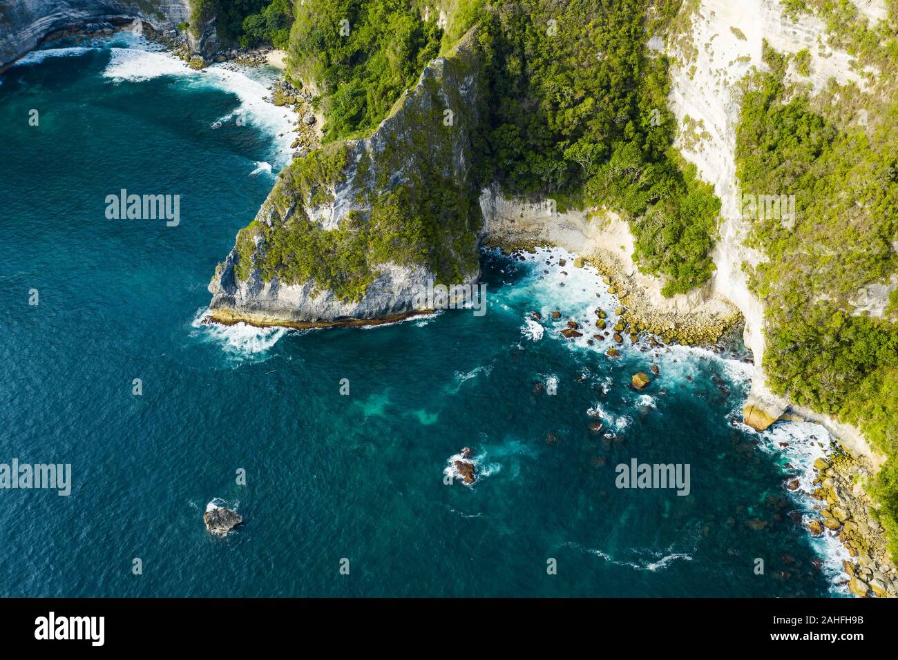 View from above, stunning aerial view of a green limestone cliff bathed ...