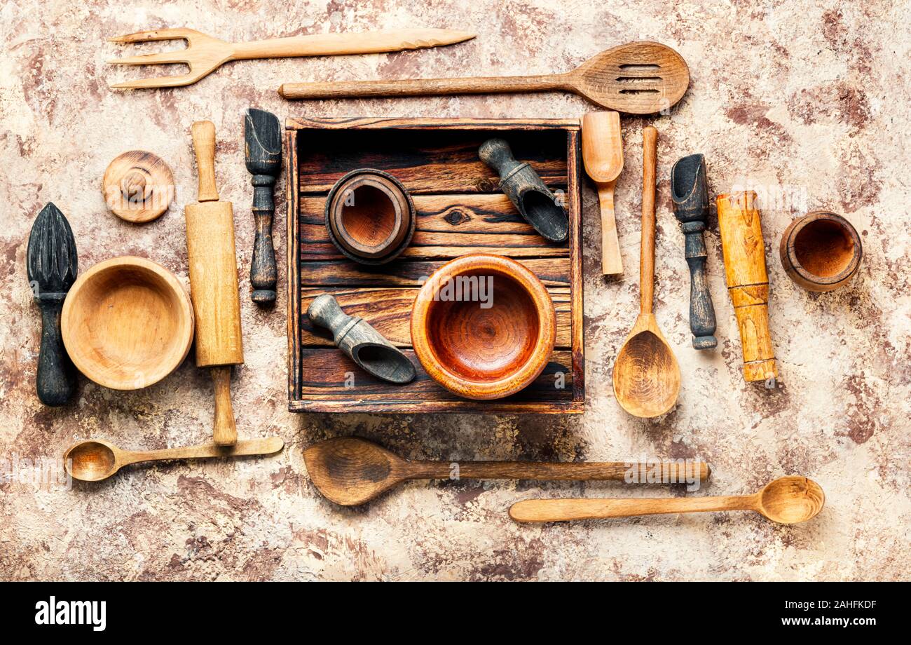 Concept of wooden rustic kitchenware utensils set on old background ...