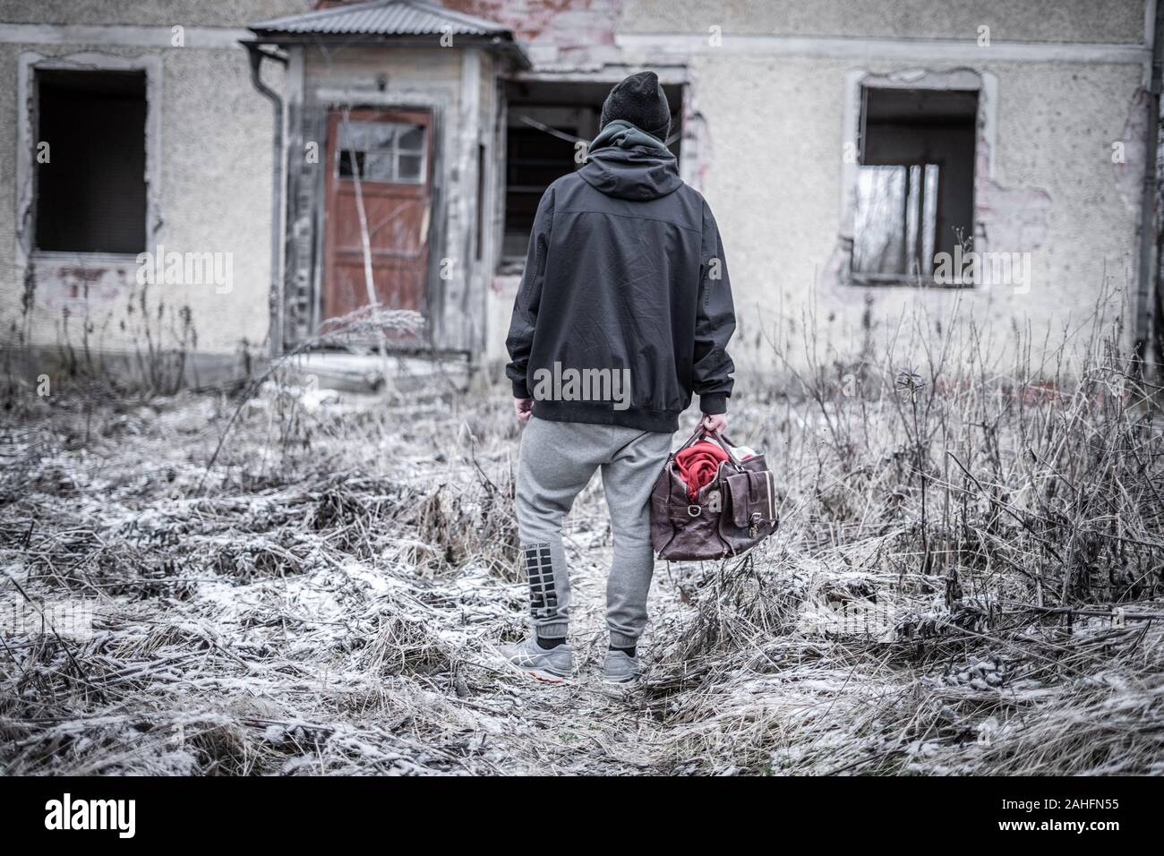 welcome home. guy entering abandoned house Stock Photo - Alamy