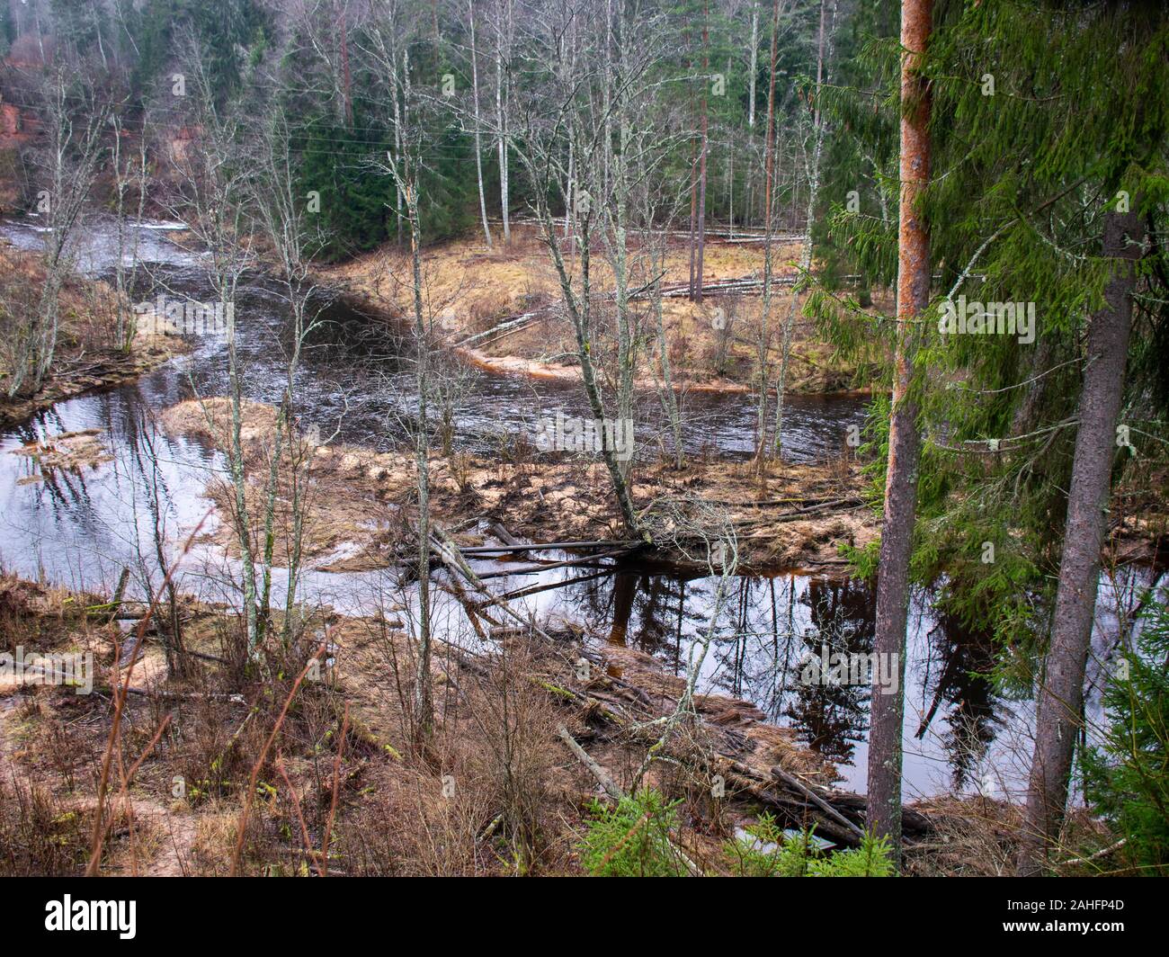 landscape with sandstone cliff on river bank fuzzy and calm water Stock ...