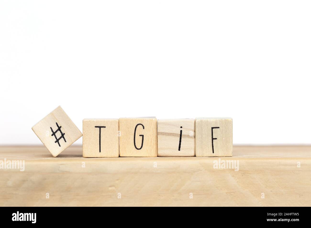 Wooden cubes with Hashtag and the word tgif, meaning Thank god its ...
