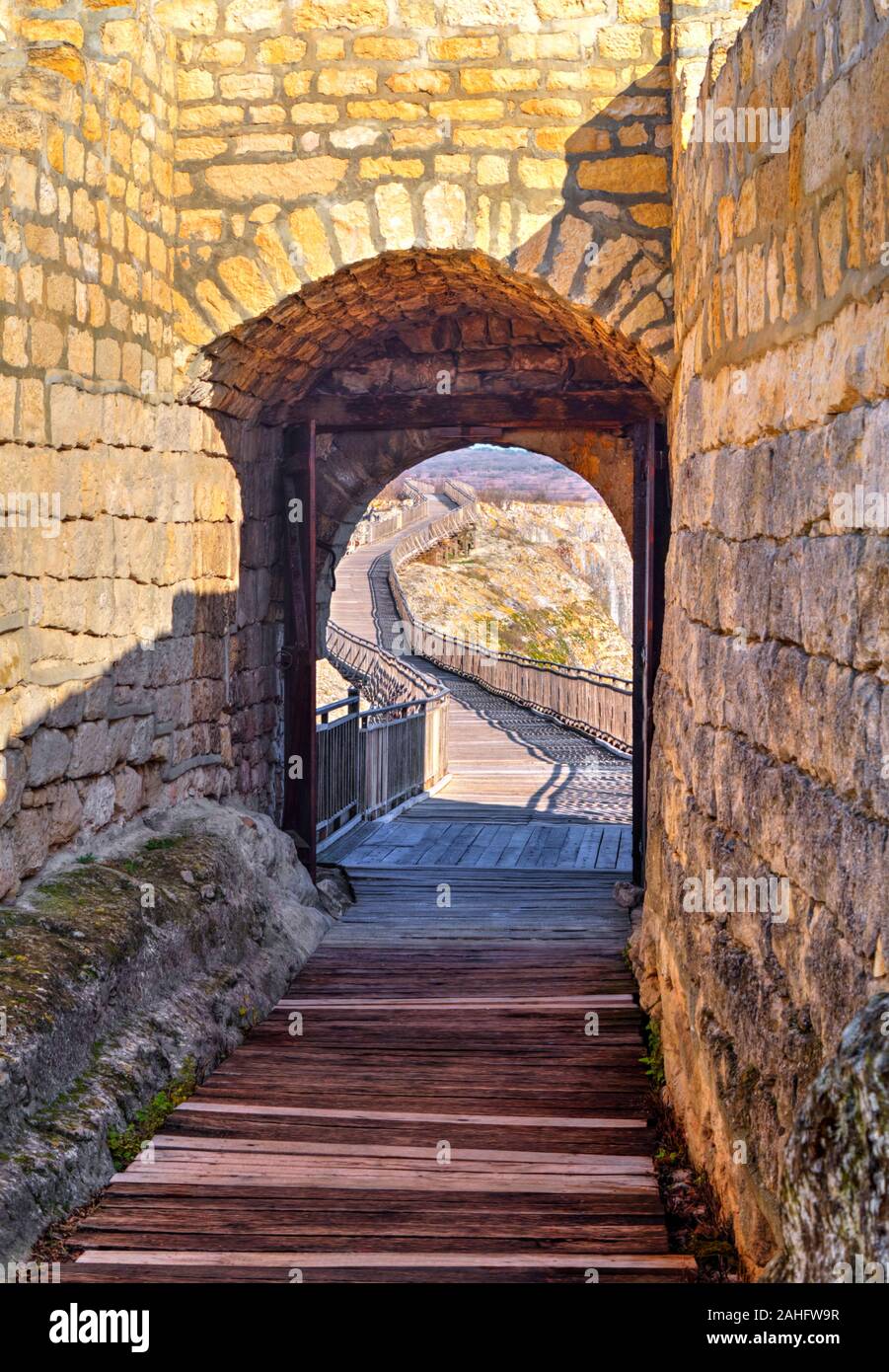 A look thru an opened stone gate of an ancient fortress Stock Photo - Alamy