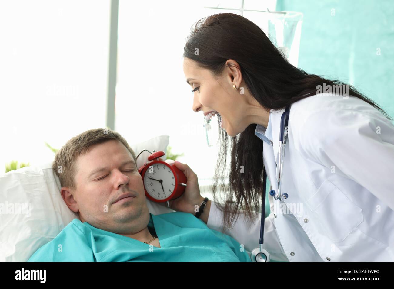 Nurse screaming awaking to patient Stock Photo - Alamy