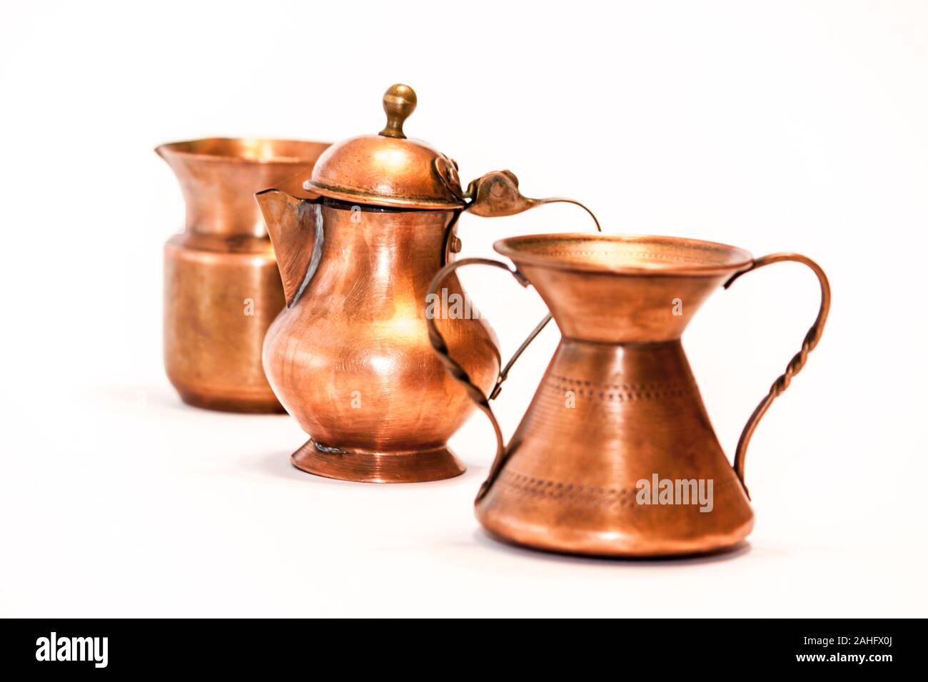 Series of little decorative copper artisan objects isolated on white ...