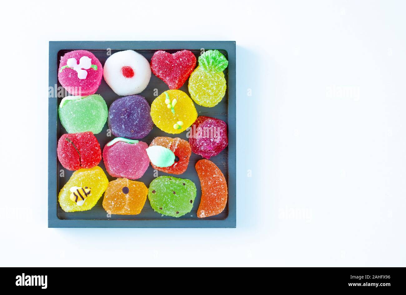 Fruit shaped Jellies in a square tray, top view (white background Stock ...