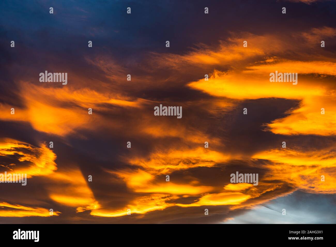 Red clouds on blue sky background in sunset time Stock Photo - Alamy