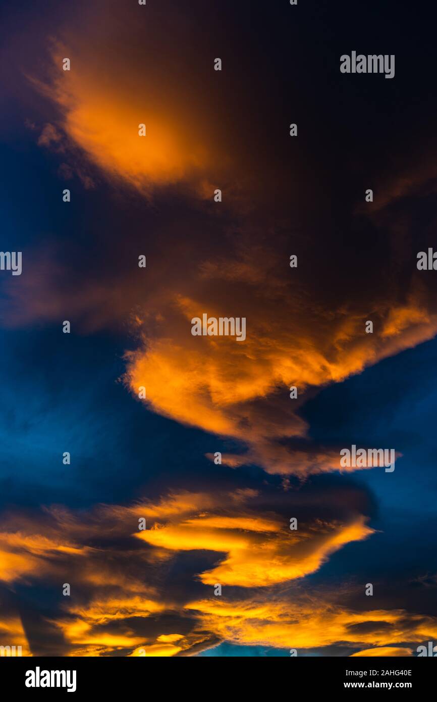 Red clouds on blue sky background in sunset time Stock Photo - Alamy