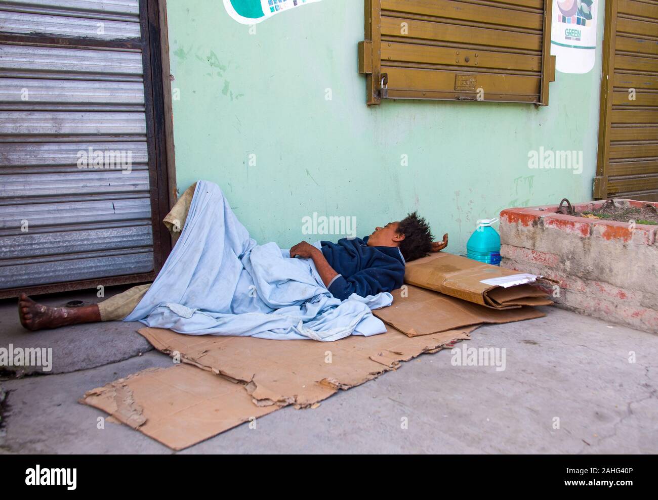 Homeless woman sleeping hi-res stock photography and images - Alamy