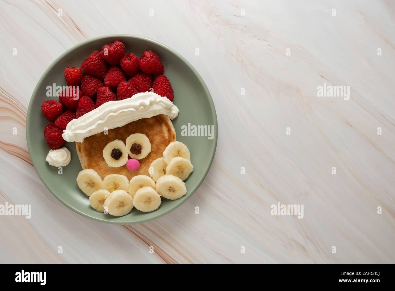 Christmas Santa pancake with raspberry and banana for kids breakfast ...