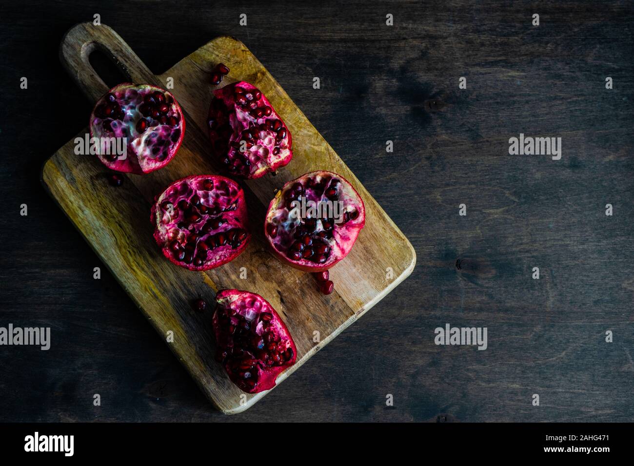 Organic food concept with fresh and ripe pomegranate on rustic ...