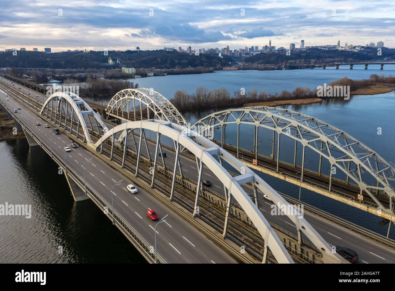 Aerial top view of automobile and railroad Darnitsky bridge across ...
