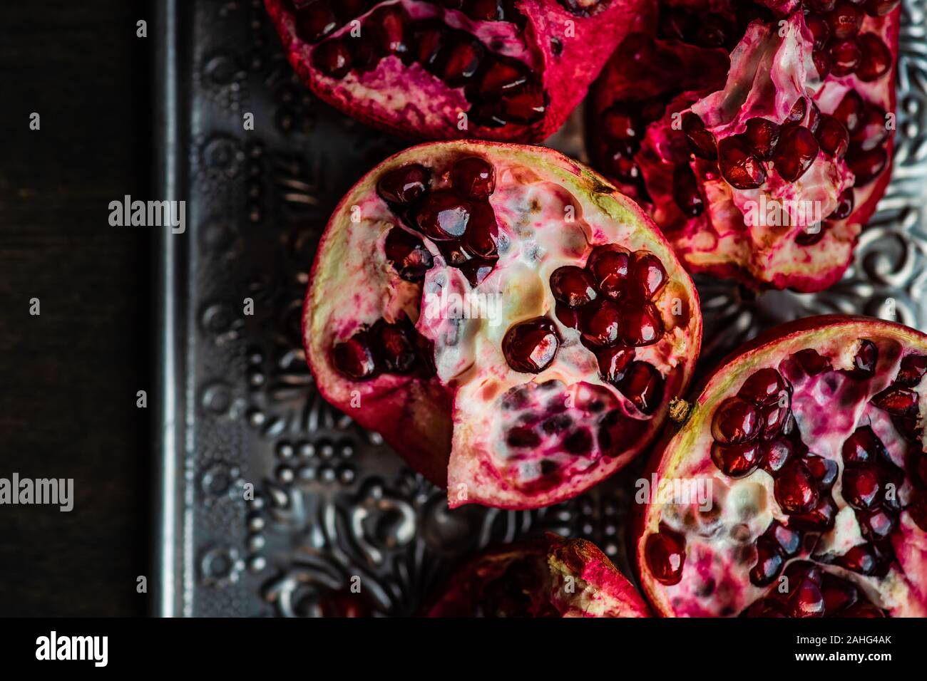 Organic food concept with fresh and ripe pomegranate on rustic ...