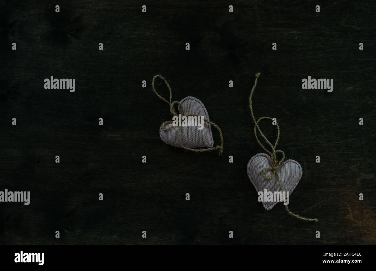 St. Valentine card concept with heart shaped decor on wooden background ...