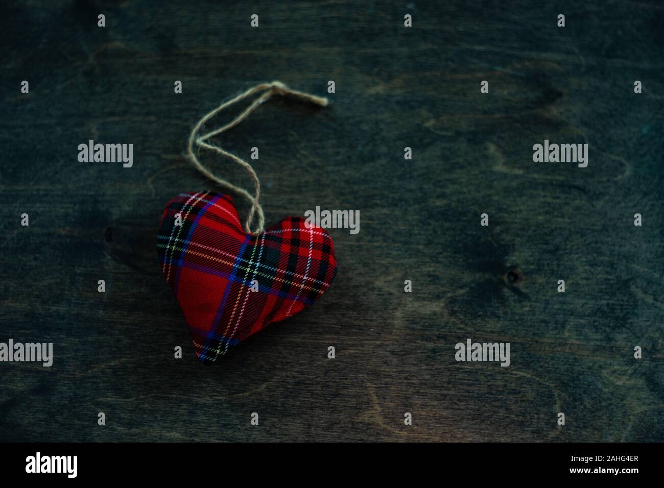 St. Valentine card concept with heart shaped decor on wooden background ...