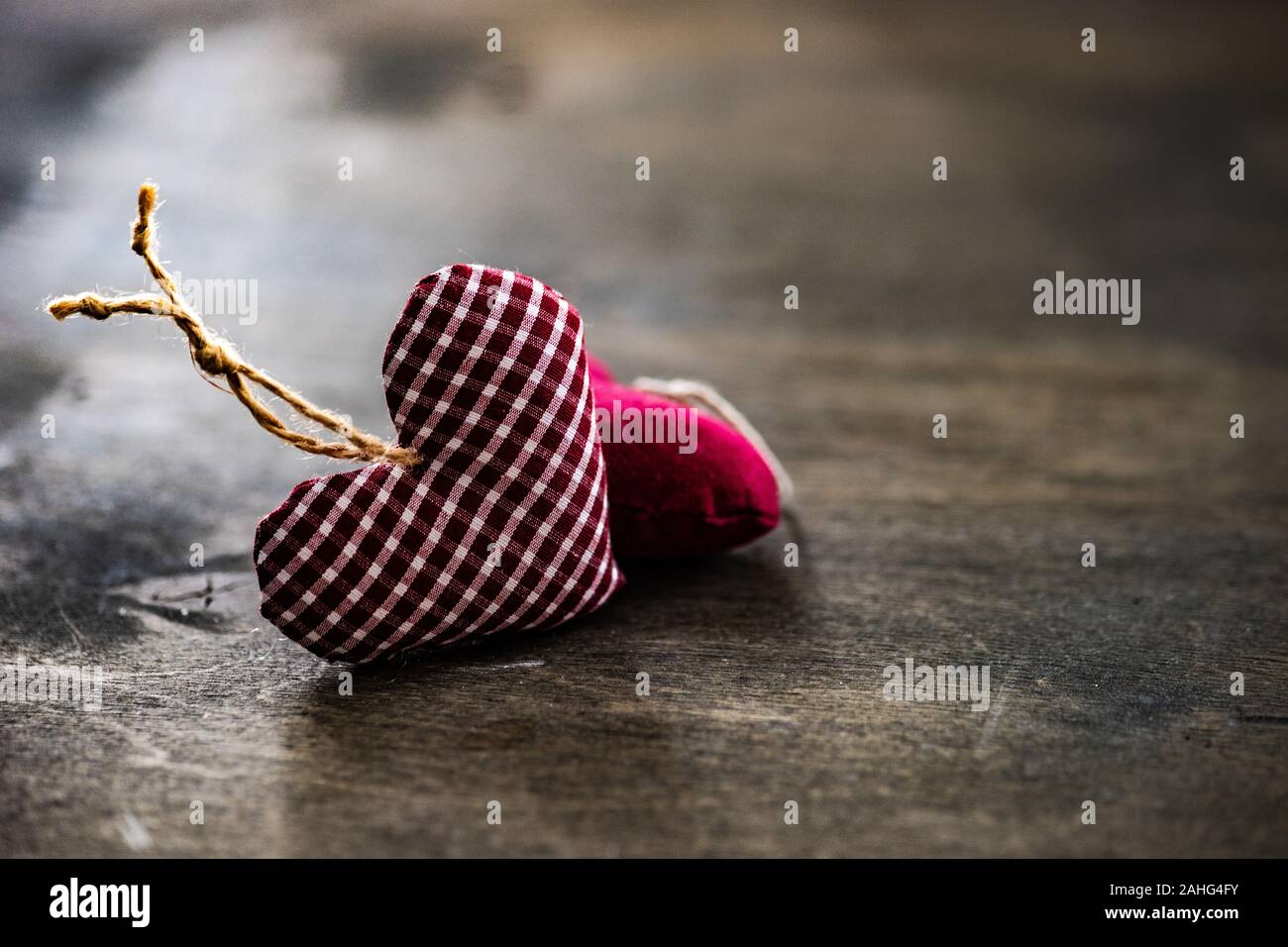 St. Valentine card concept with heart shaped decor on wooden background ...