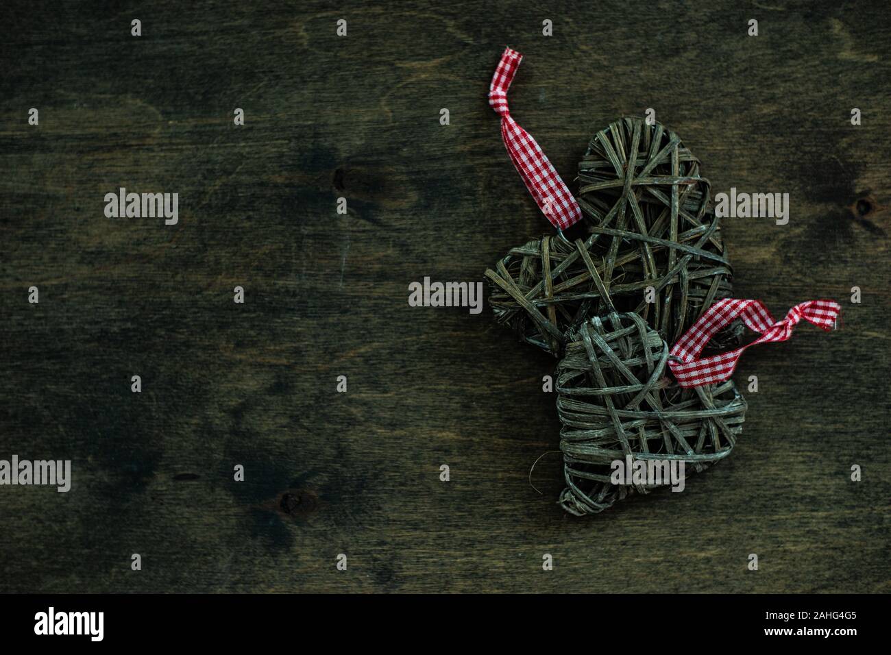 St. Valentine card concept with heart shaped decor on wooden background ...