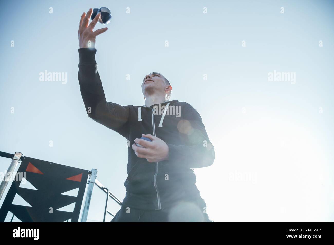 Concentrated sportsman catching balls while having his training Stock ...