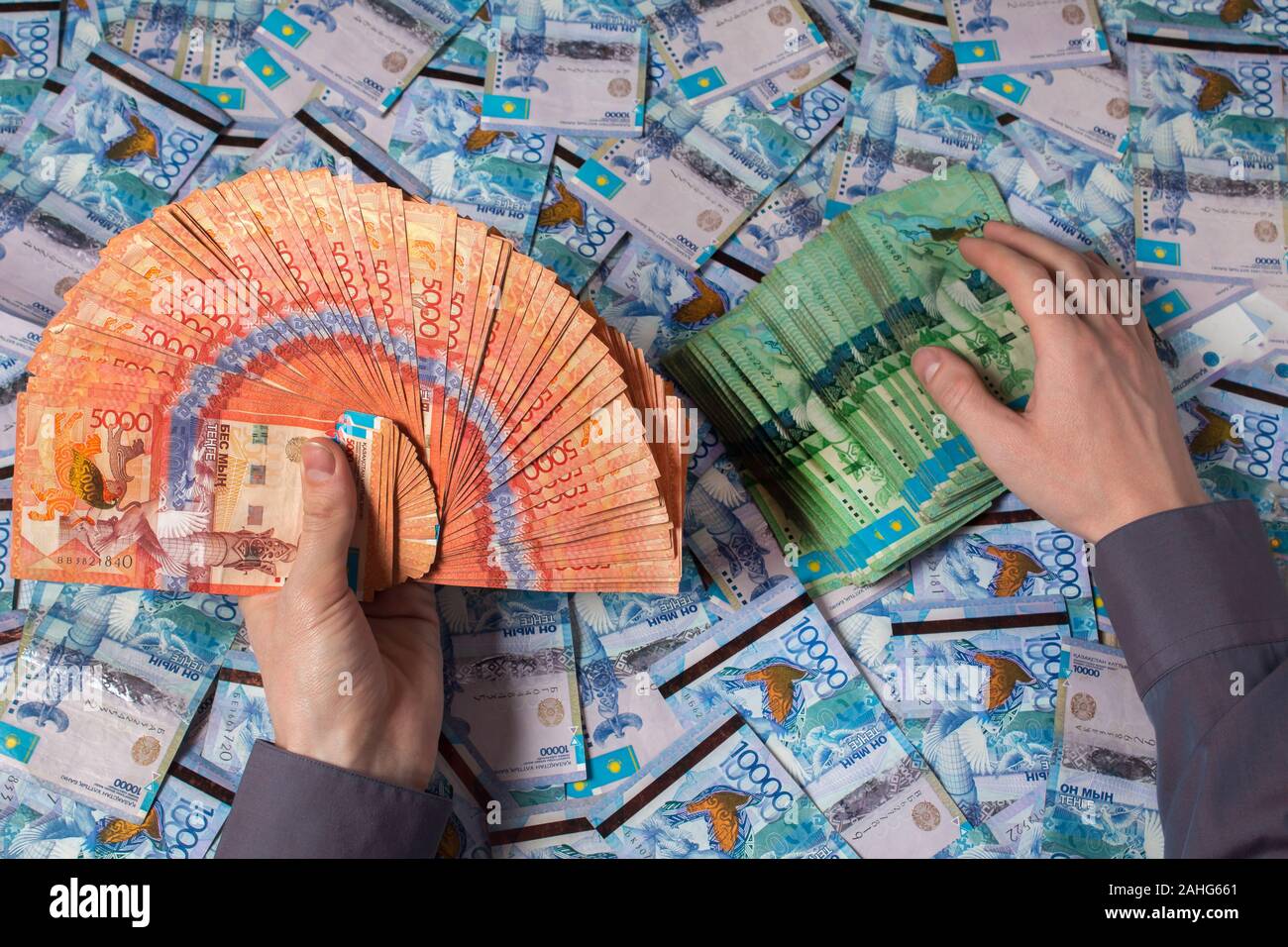 Hands holding Kazakhstani tenge money. Paper banknotes tenge KZT. Tenge ...
