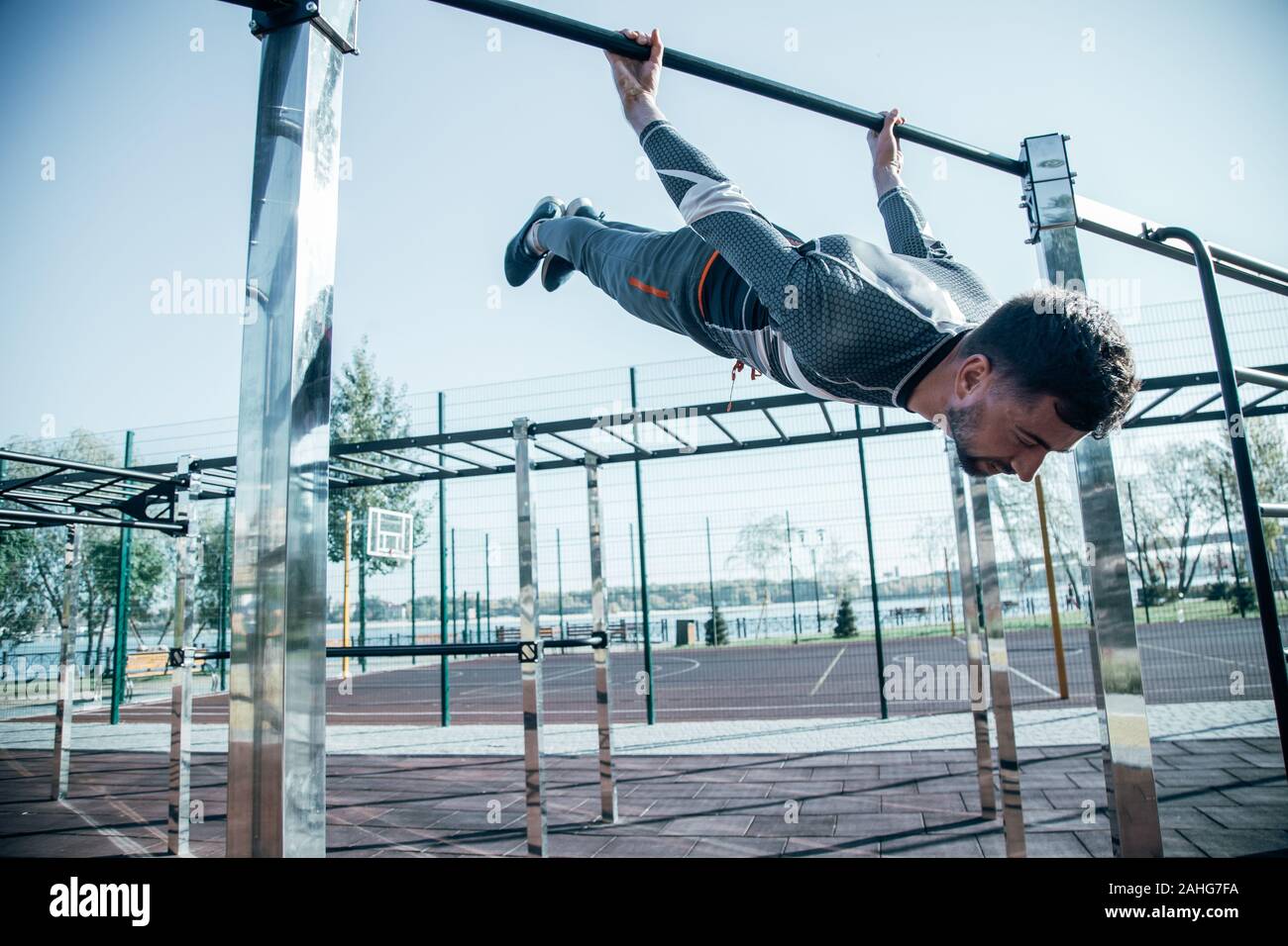 Hanging from chin up bar hi-res stock photography and images - Alamy