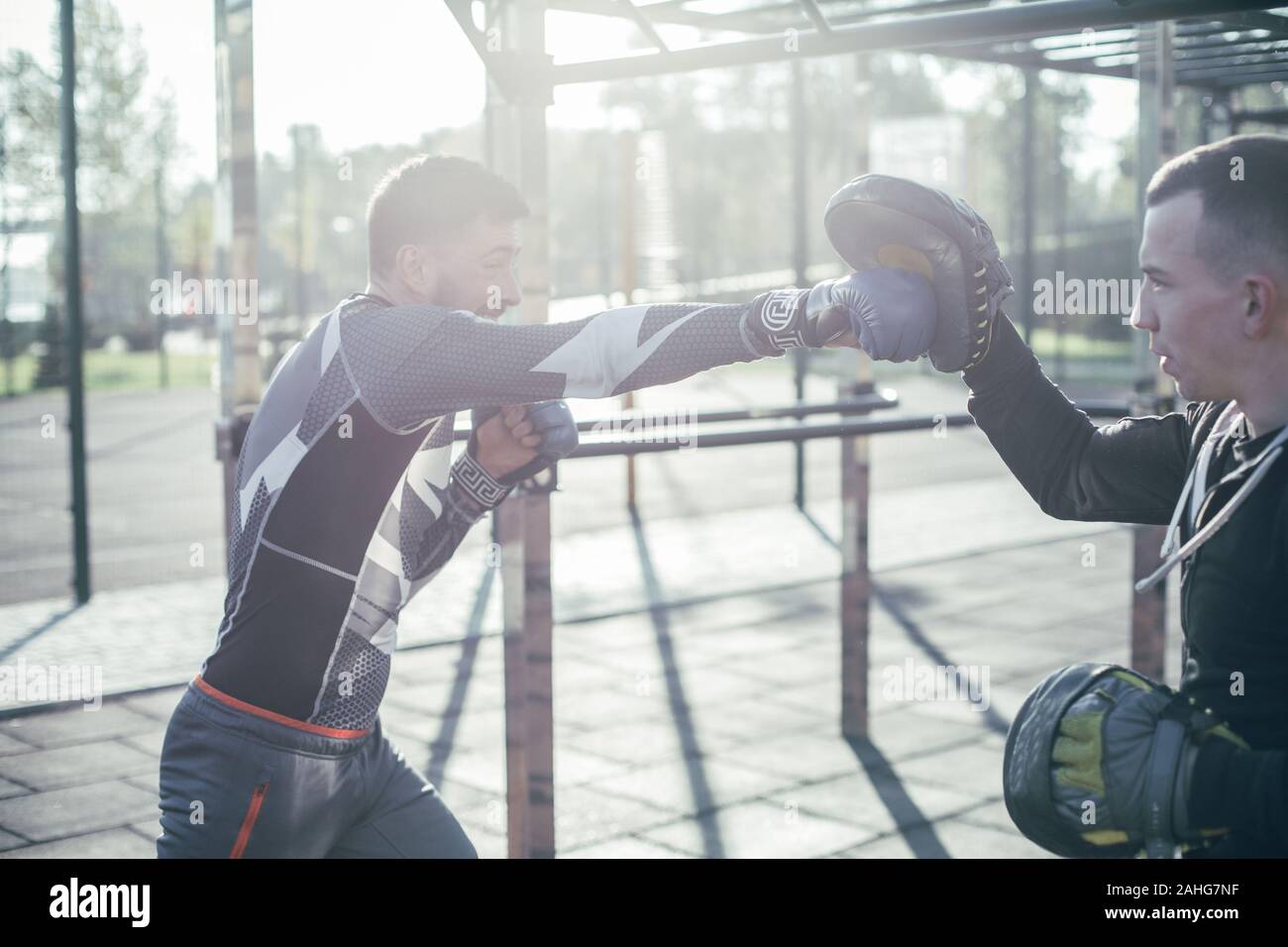 Professional boxer performing his best punches during the training ...