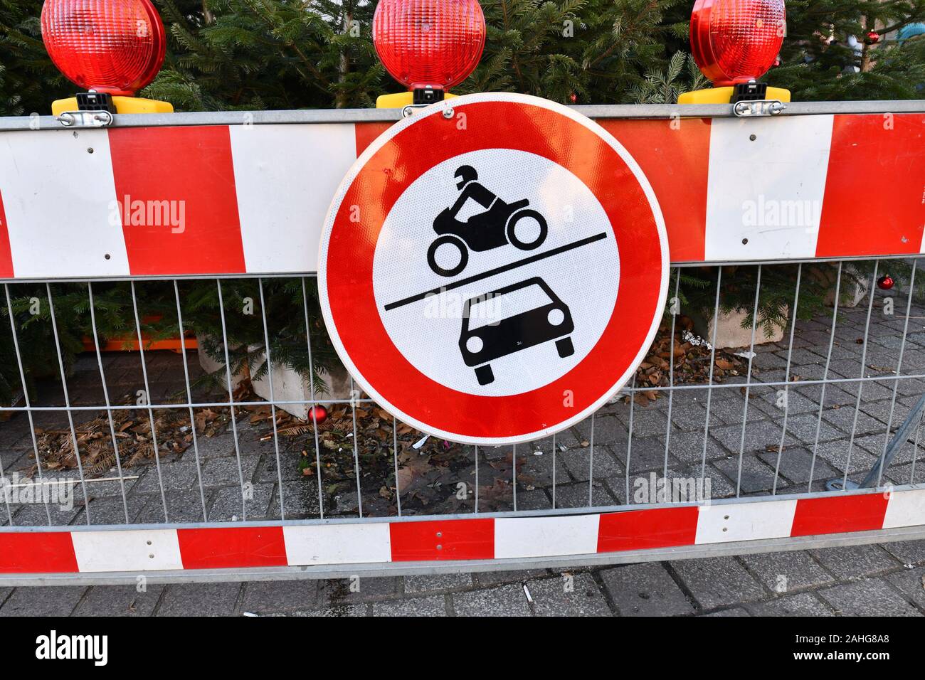 Round red 'No access to motor vehicles road sign' on red metal barrier ...
