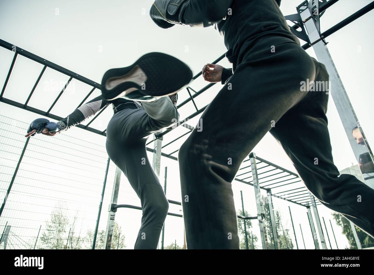 Close up of MMA sportsman doing punch with his foot Stock Photo - Alamy