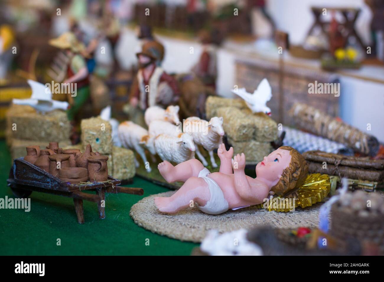 Baby Jesus figure on Nativity scene souvenirs. Christianity religion ...