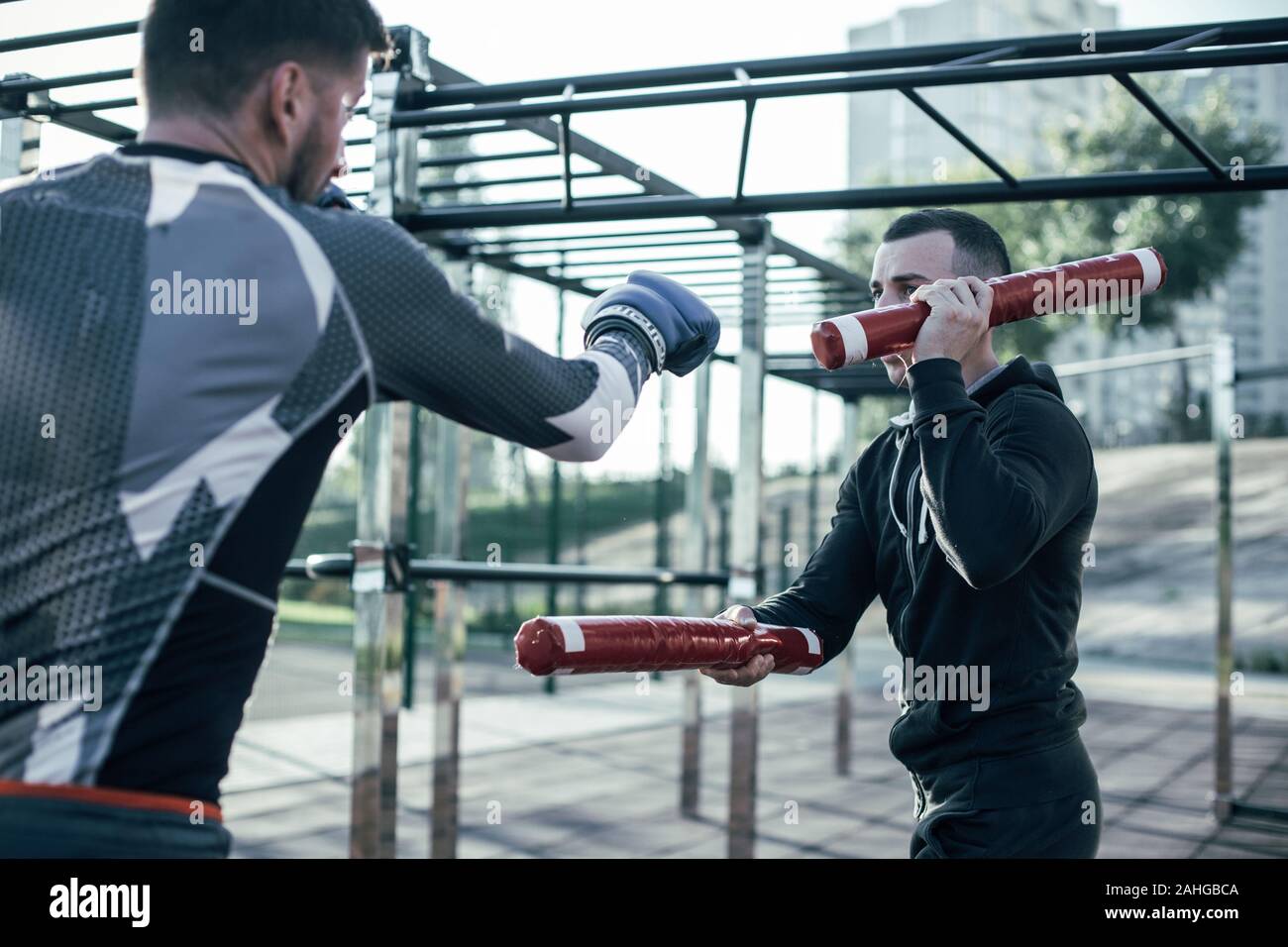 Young Man Holding Boxing Gloves High Resolution Stock Photography and ...